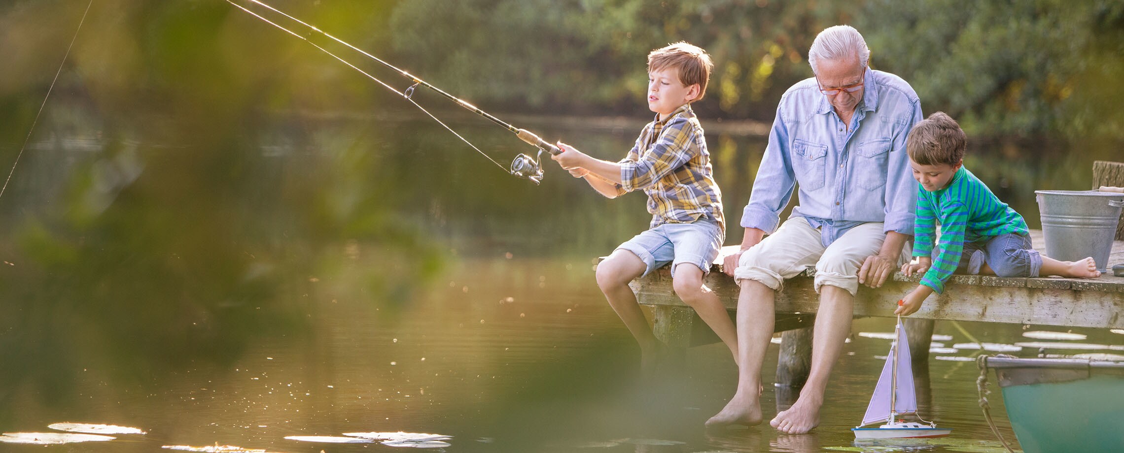 Grandparents With Grandchild Fishing