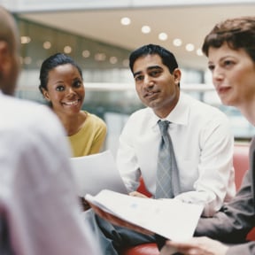 Multicultural business group with papers